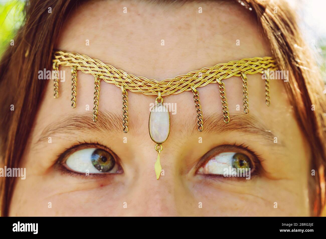 Closeup of young womans head wearing romantic metal tiara on her ...