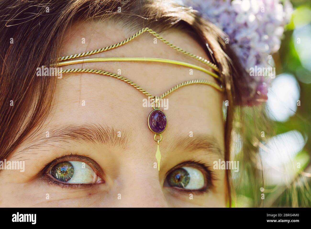 Closeup of young womans head wearing romantic metal tiara on her ...