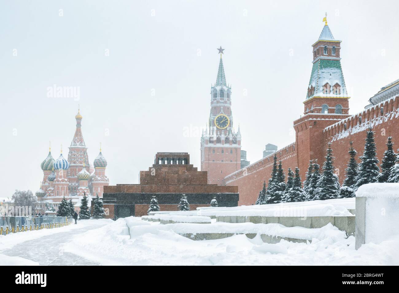Red Square with Saint Basil`s Cathedral and Kremlin during snowfall in ...
