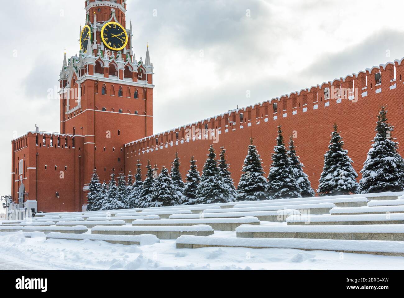 Moscow Kremlin with Spasskaya Tower on the Red Square during snowfall ...