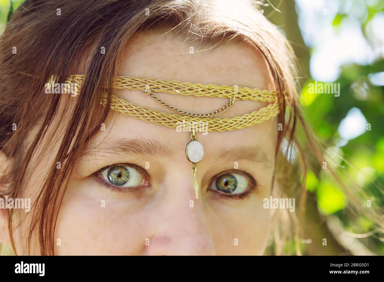 Closeup of young womans head wearing romantic metal tiara on her ...