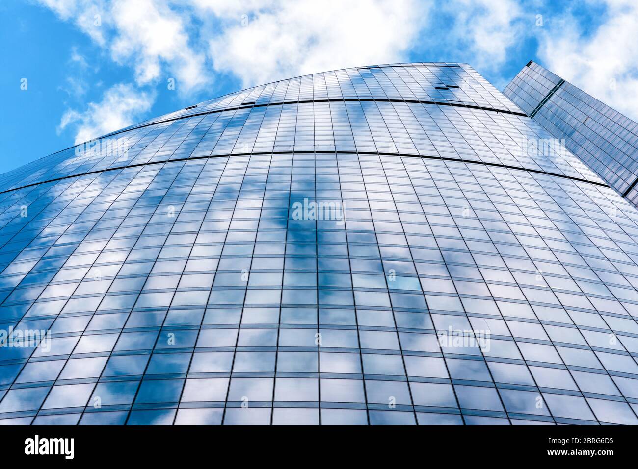 The sky is reflected in a modern skyscraper. Background and concept of ...