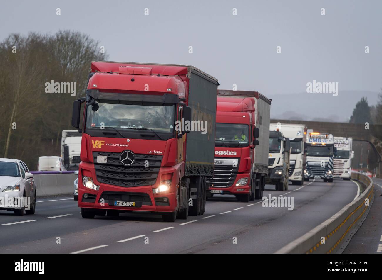Lorries driving on a busy motorway in England, United Kingdom Stock ...