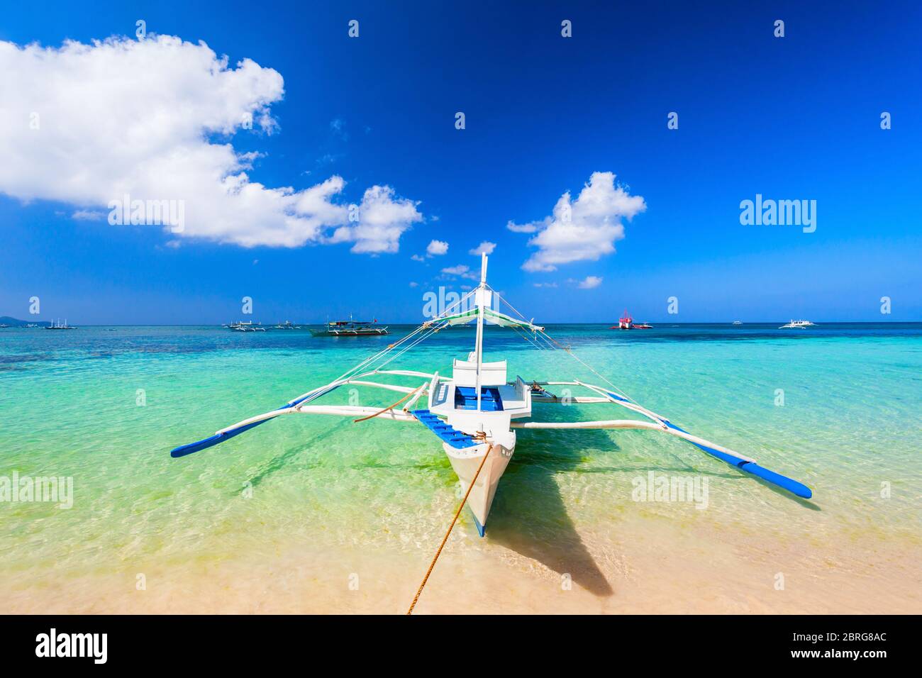 Traditional filipino boat at the idyllic white sand beach at Boracay ...