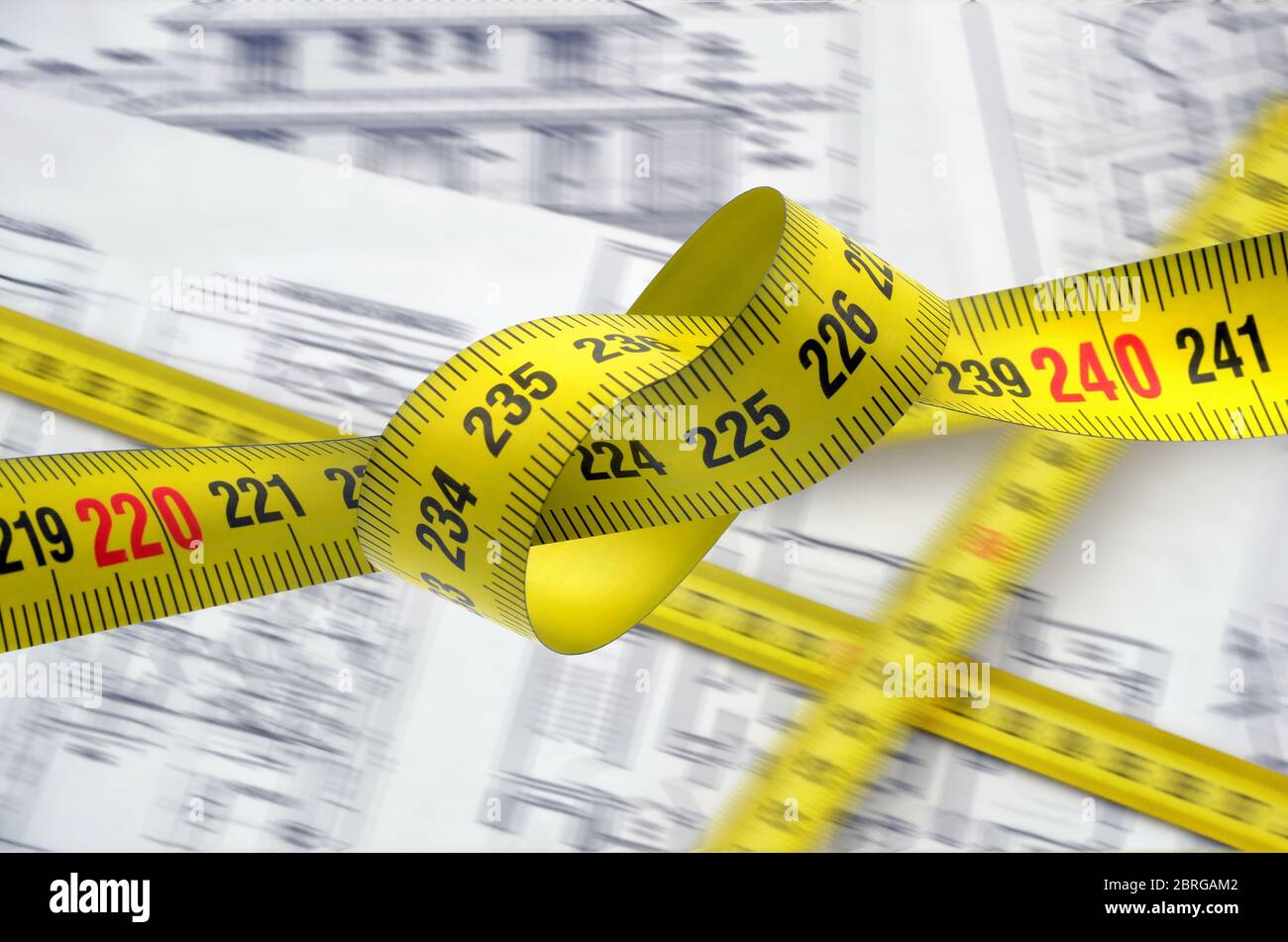 tape measure above construction plan Stock Photo - Alamy