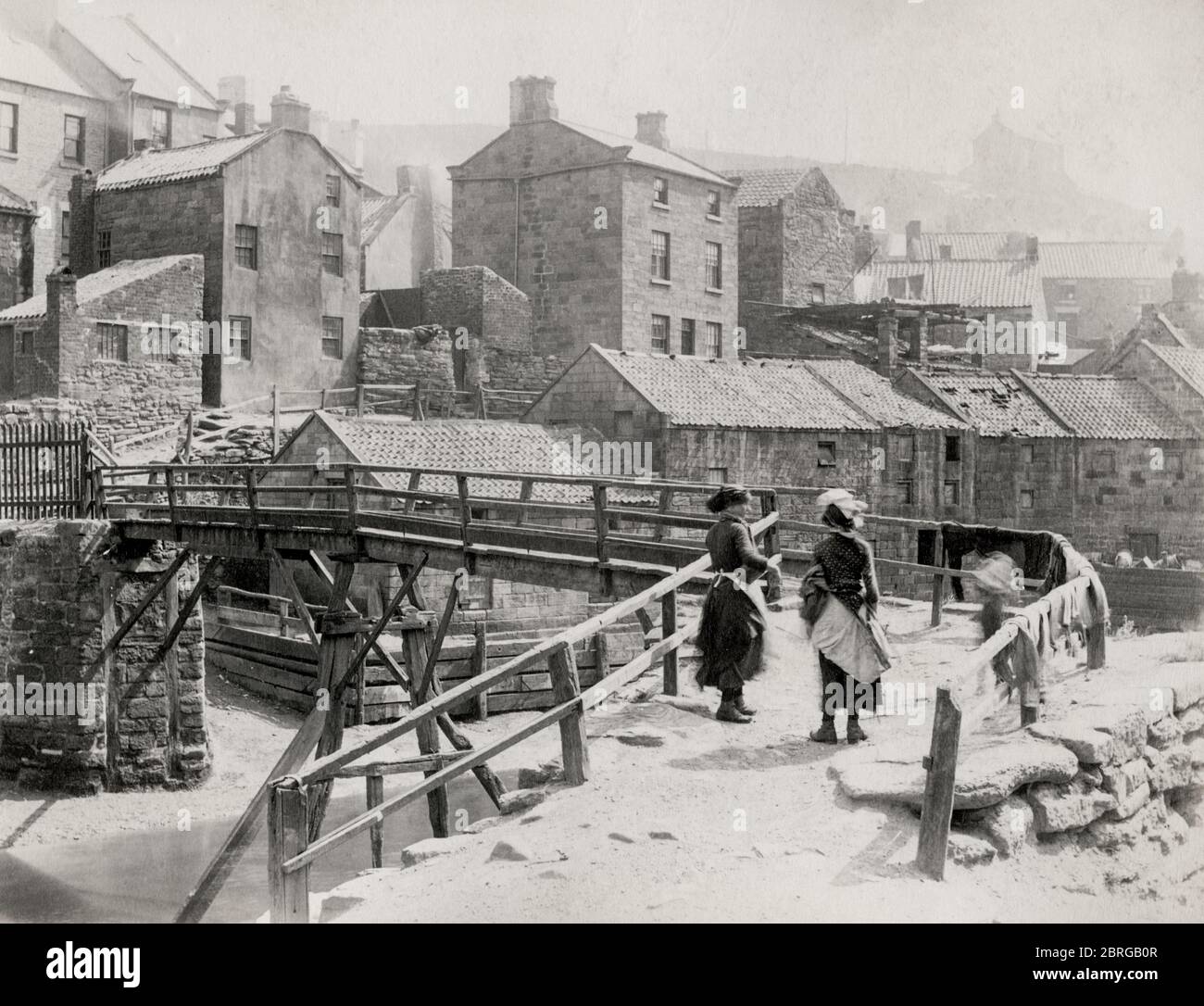 Wooden bridge over a stream at Staithes, Yorkshire Stock Photo - Alamy