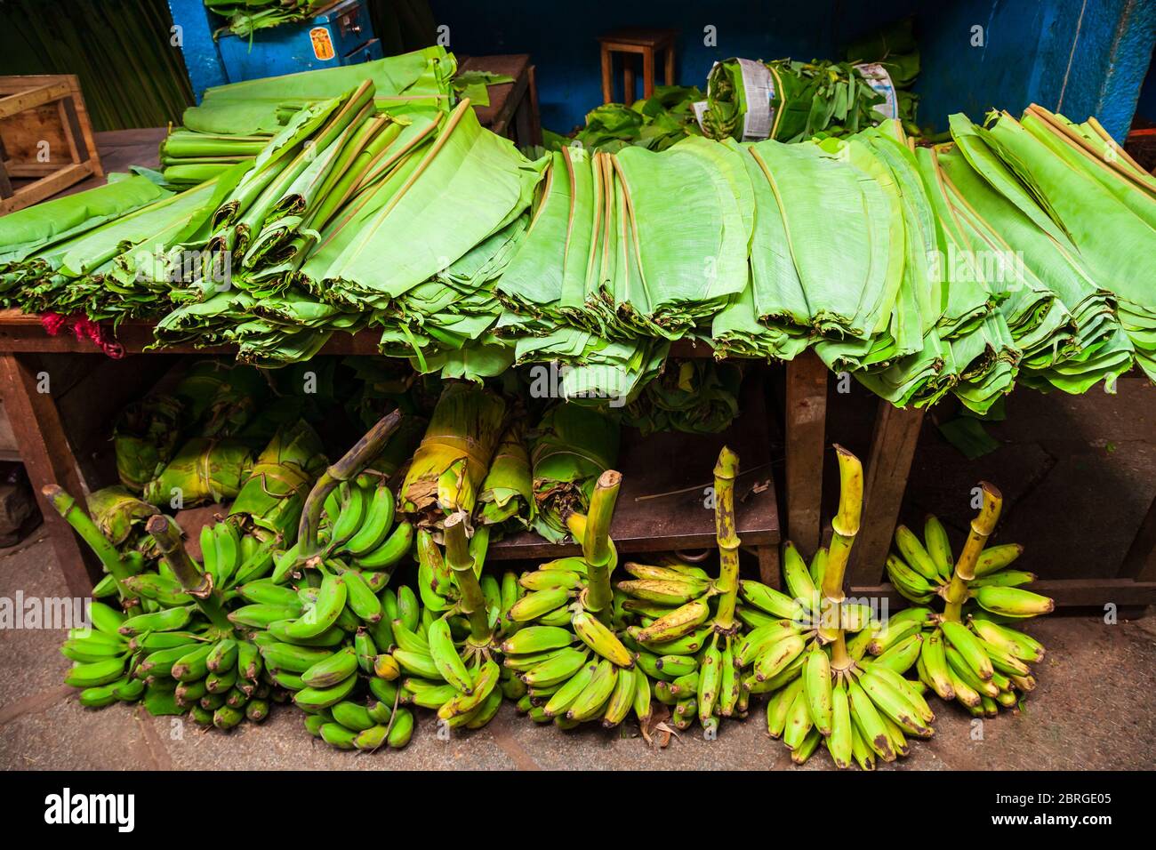 Bananas and their leaves at the local market in India Stock Photo - Alamy