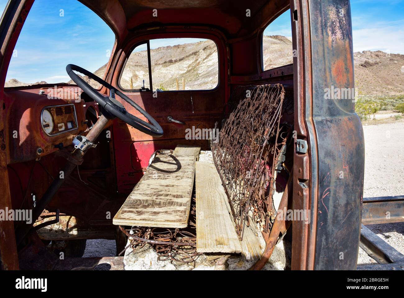 Rhyolite Ghost Town, Beatty Nevada - Rusted out antique automobile ...