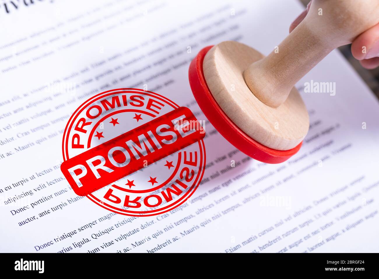 Businessman Hand Putting Promise Stamp On Document Stock Photo - Alamy