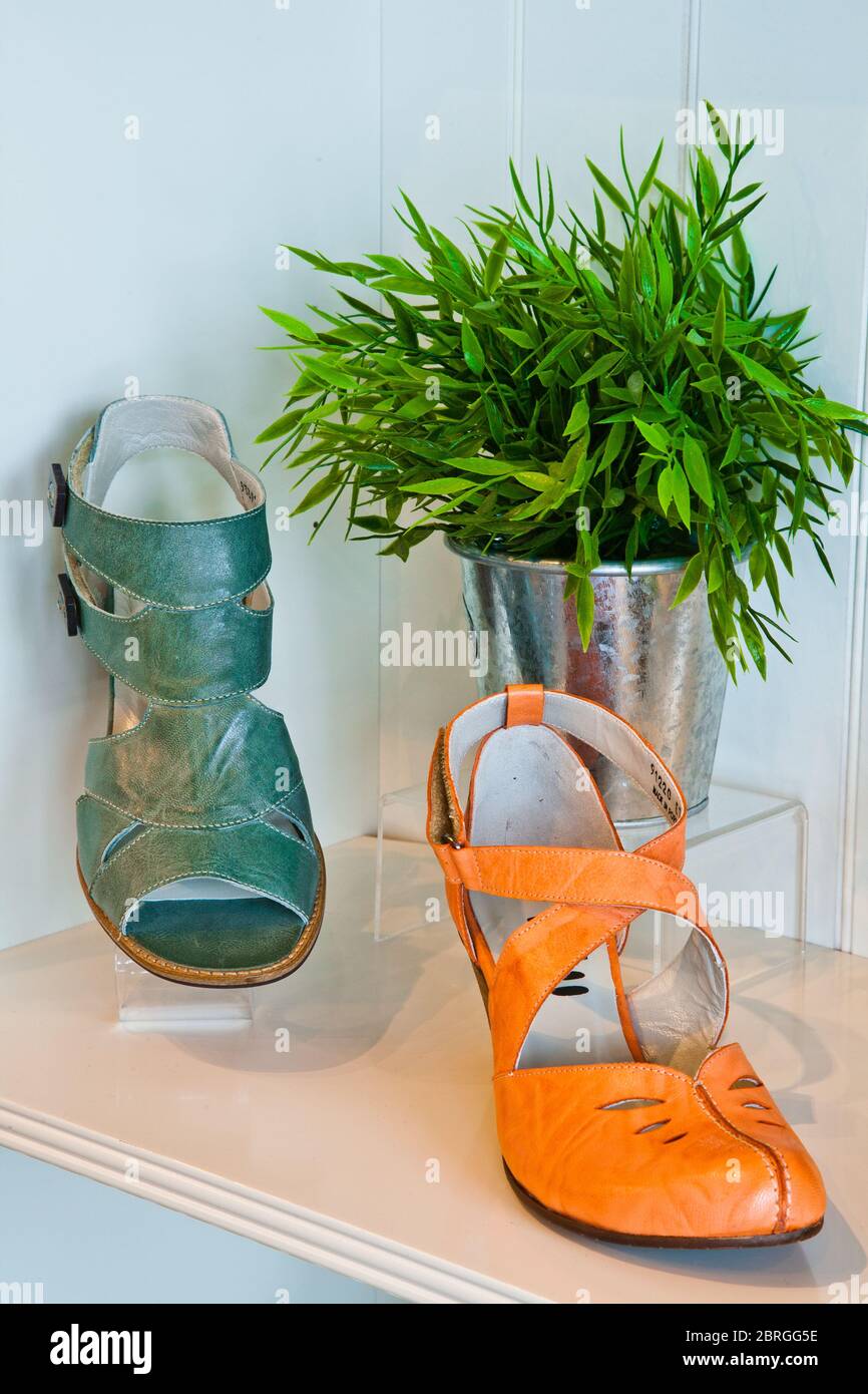 Shoes on display in a women's retail store Stock Photo - Alamy