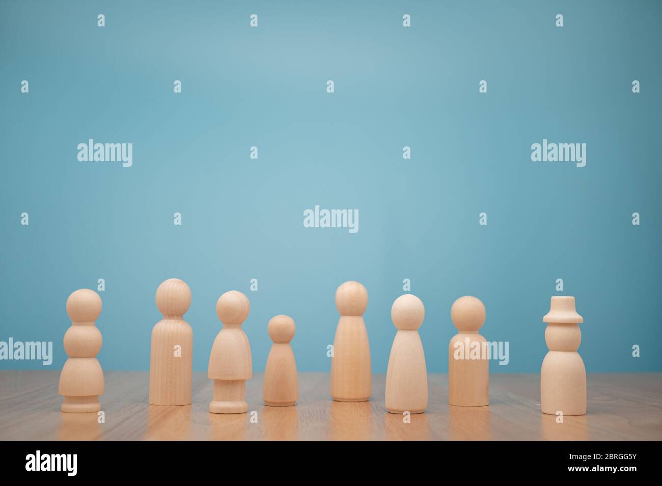 Many wooden human figures, Man and woman standing. Concept of Human ...