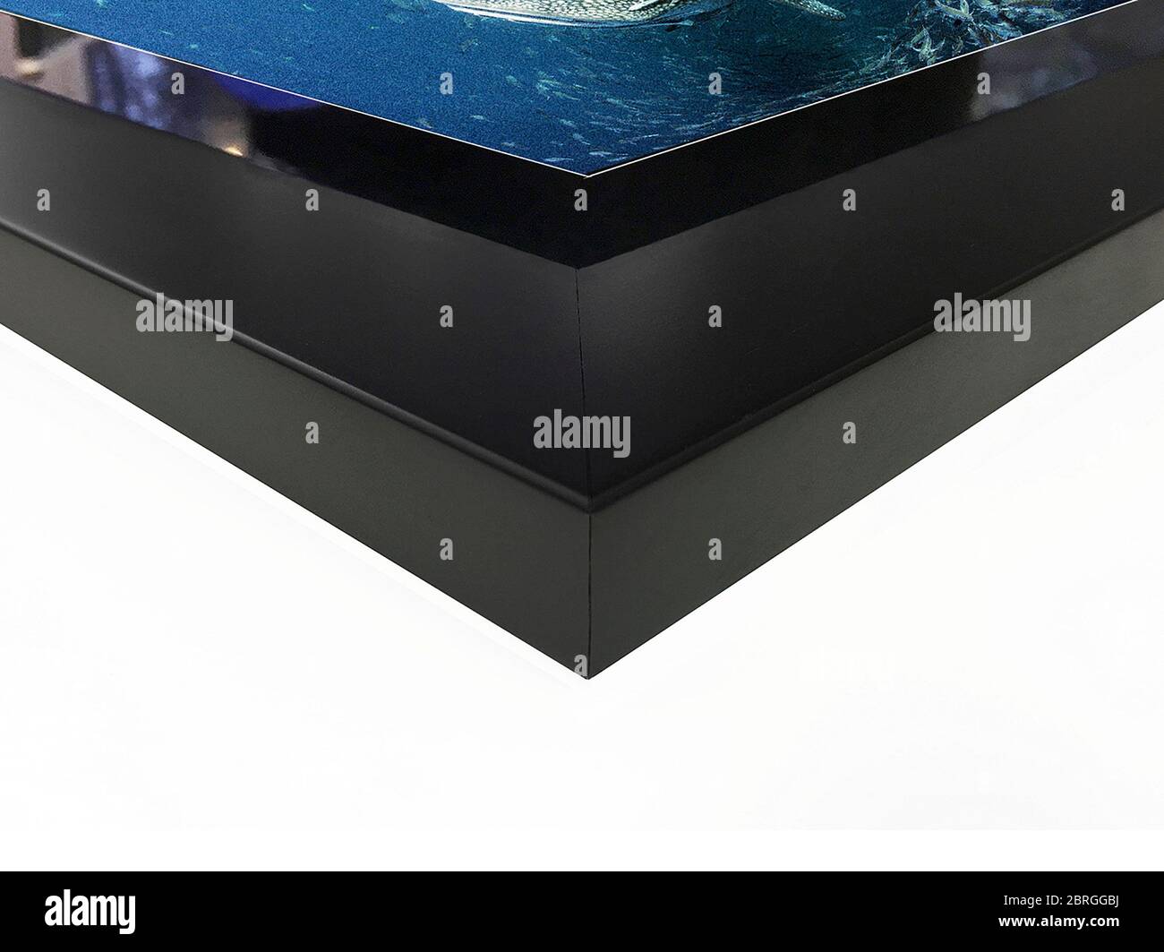 The corner and edge of a high quality wood photo frame complete with ...