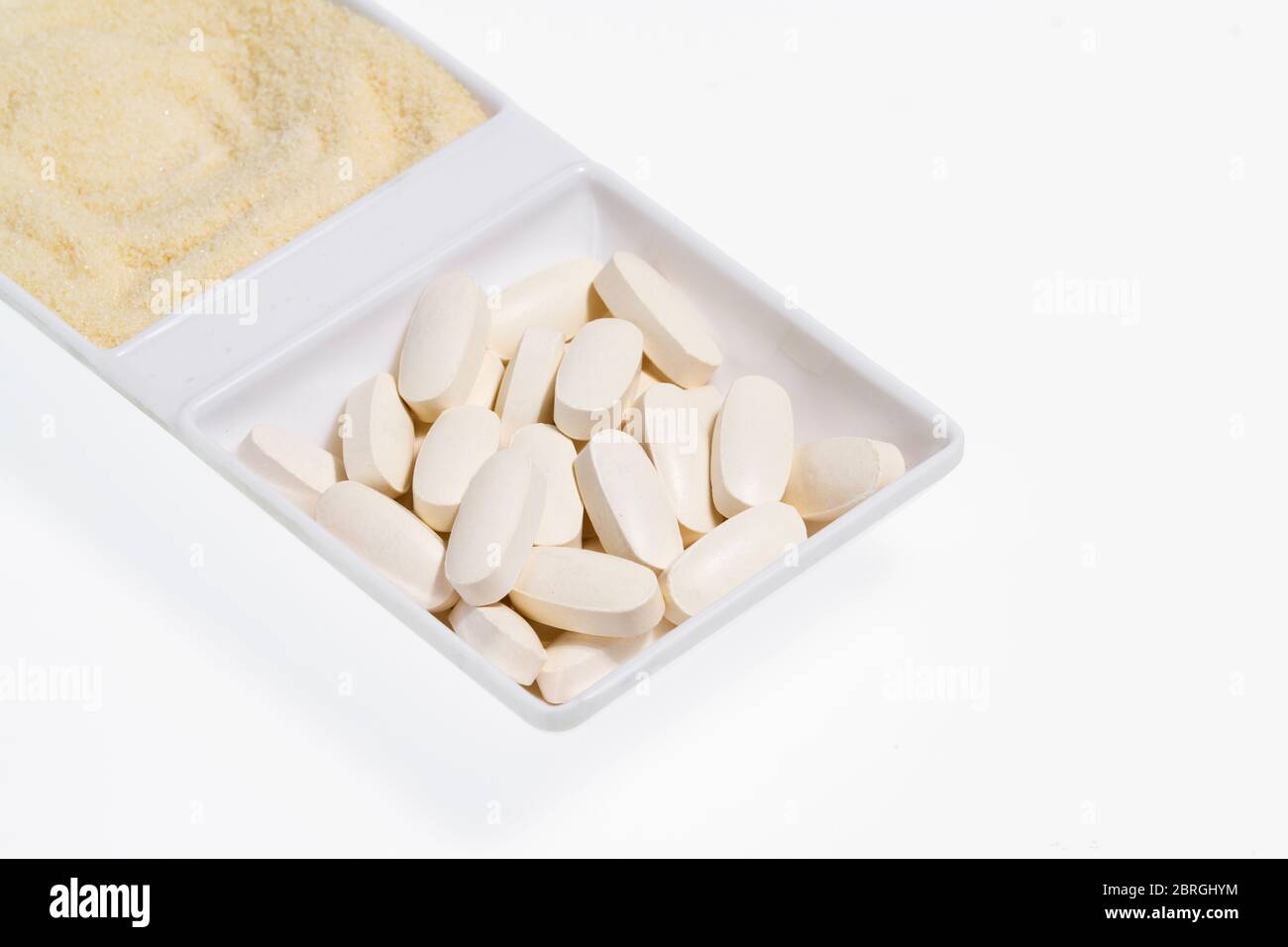 Hydrolyzed and tablet collagen isolated on white background, close-up ...