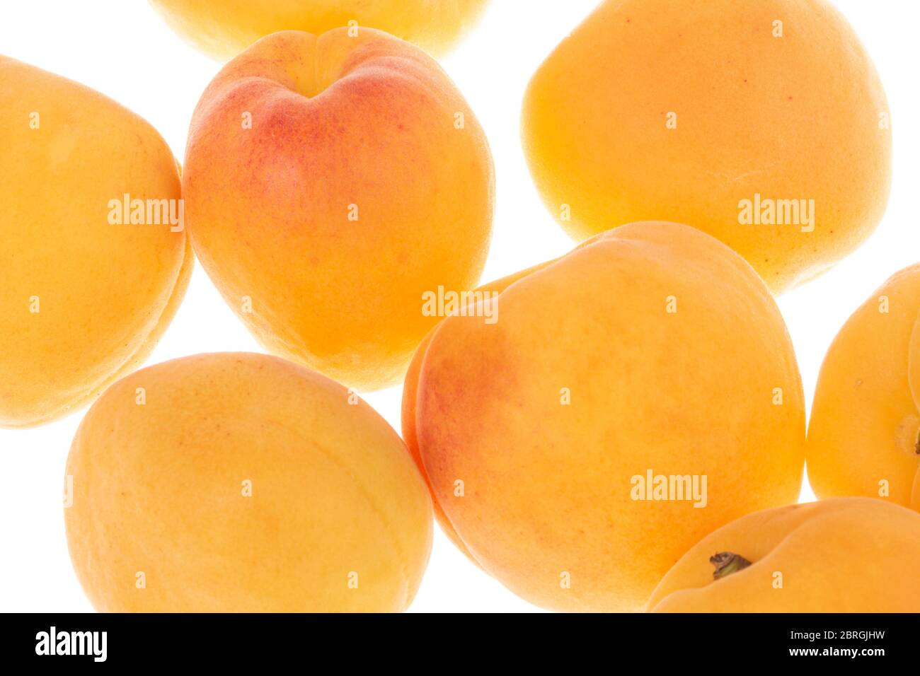 closeup fresh and ripe apricot fruits isolated on white Stock Photo - Alamy