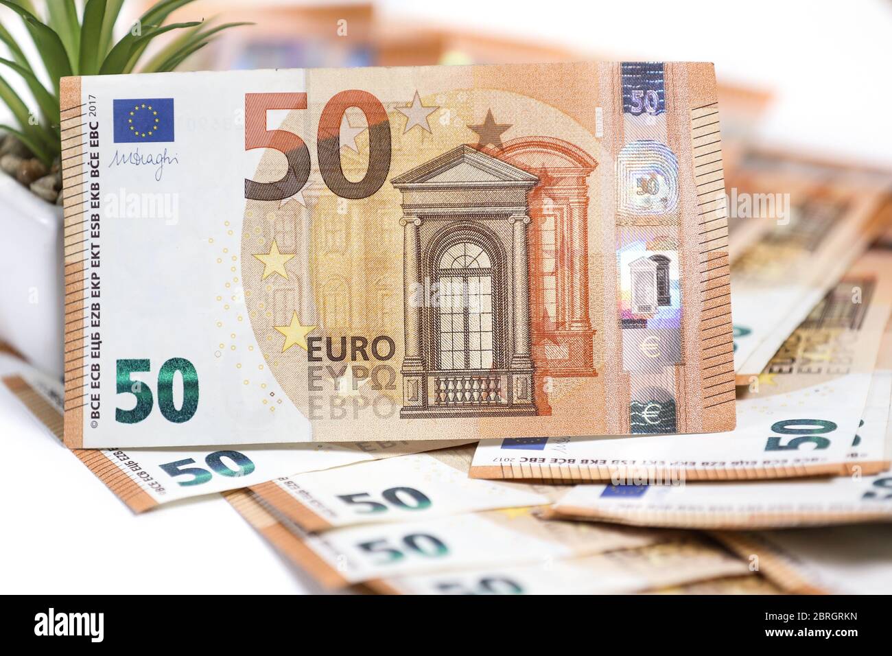 Stack of 50 euro banknotes isolated on a white background. Financial ...