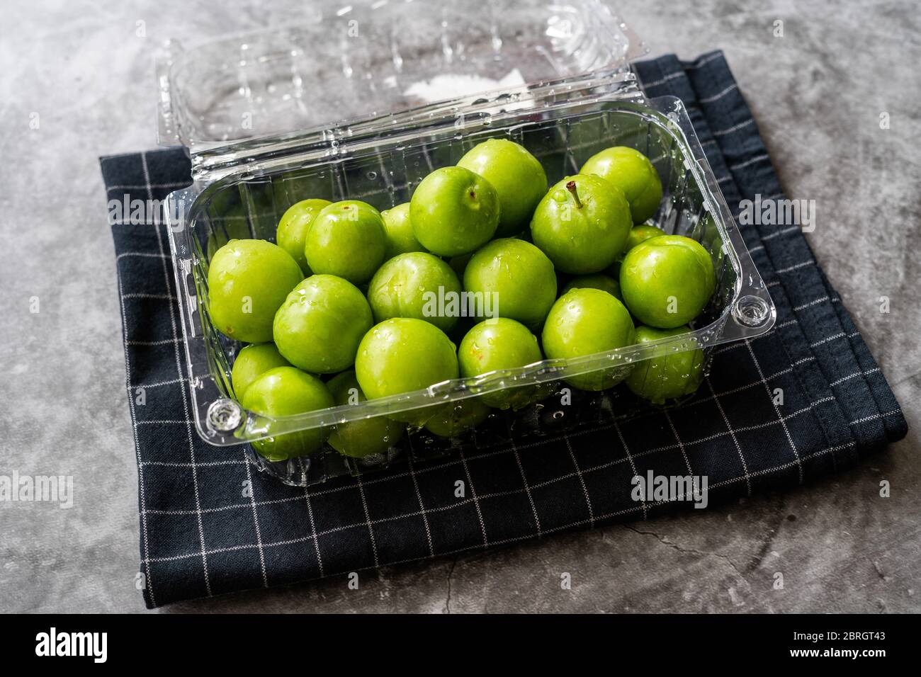 Raw Organic Sour Green Plums for Sale Ready to Eat in Plastic Container ...