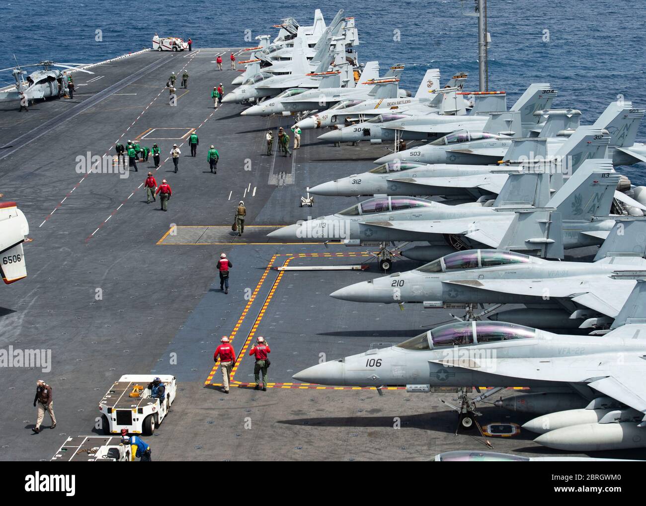 Us Navy Sailors Prepare For Flight Operations Aboard On The Flight Deck Of The Aircraft