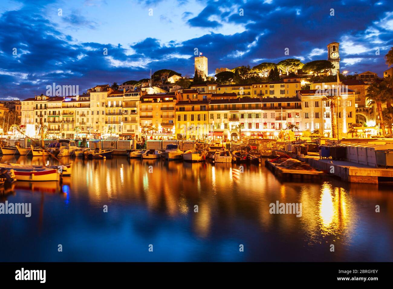 Cannes portl panoramic view at night. Cannes is a city located on the ...