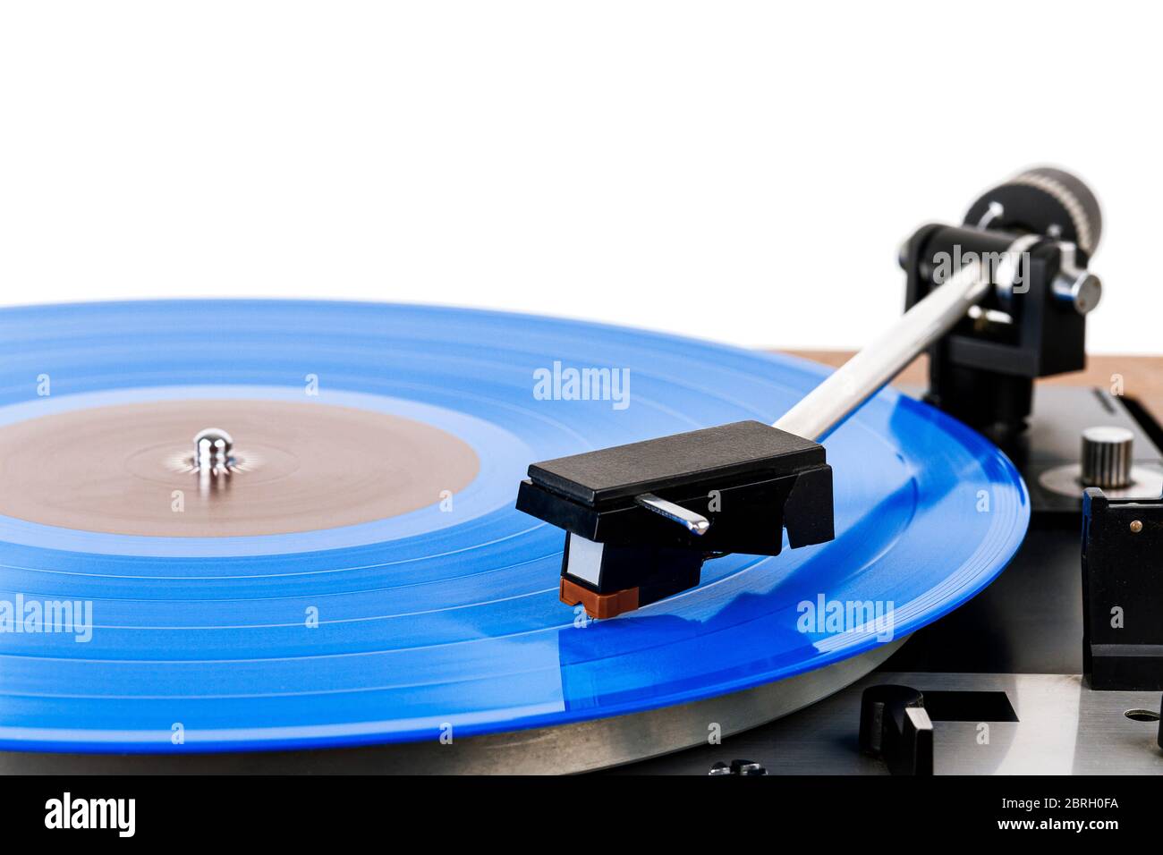 Vintage turntable with a blue vinyl isolated on white. Wooden plinth ...