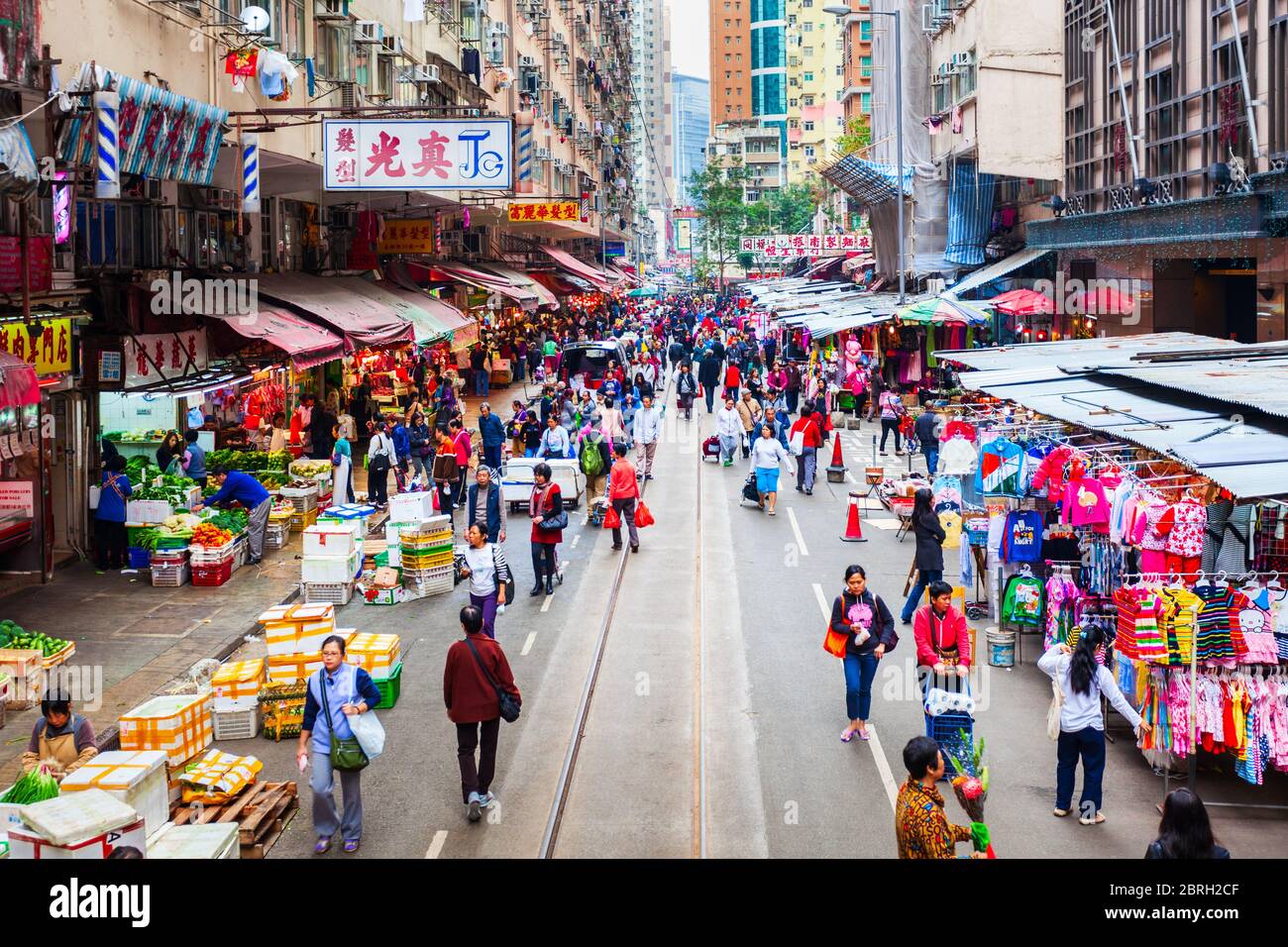 HONG KONG - FEBRUARY 22, 2013: Pedestrians rush crossing through a very ...