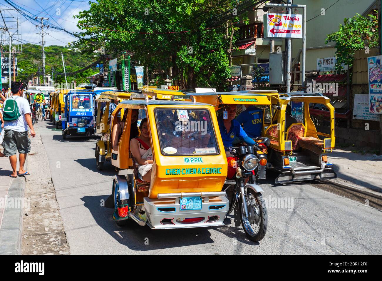 BORACAY, PHILIPPINES - MARCH 04, 2013: Tricycle at the main street in ...