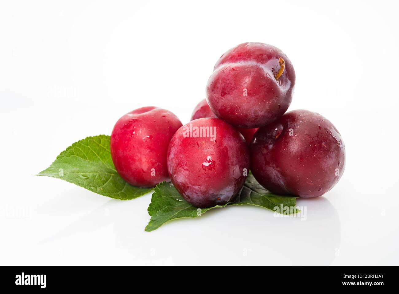fresh plum isolated on white background Stock Photo - Alamy