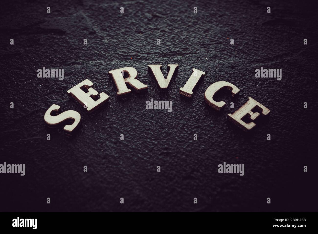 Word service written on black background Stock Photo - Alamy