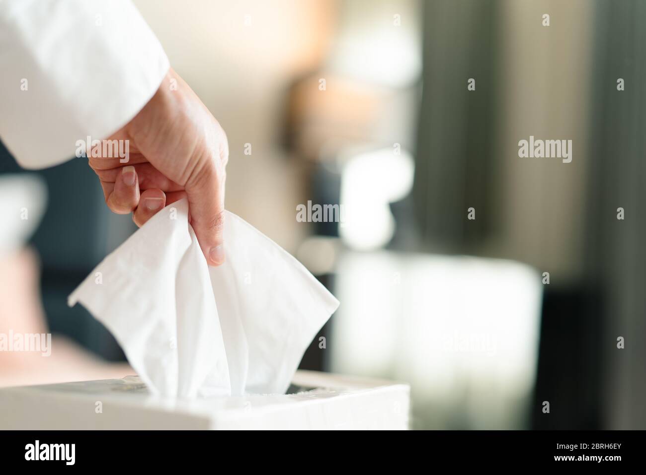 women hand picking napkin/tissue paper from the tissue box Stock Photo ...