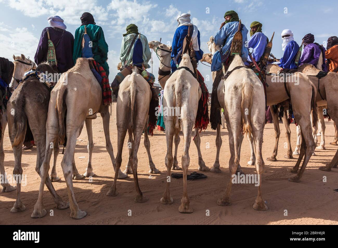 tuareg people in traditional clothes sitting on camels in desert Stock ...