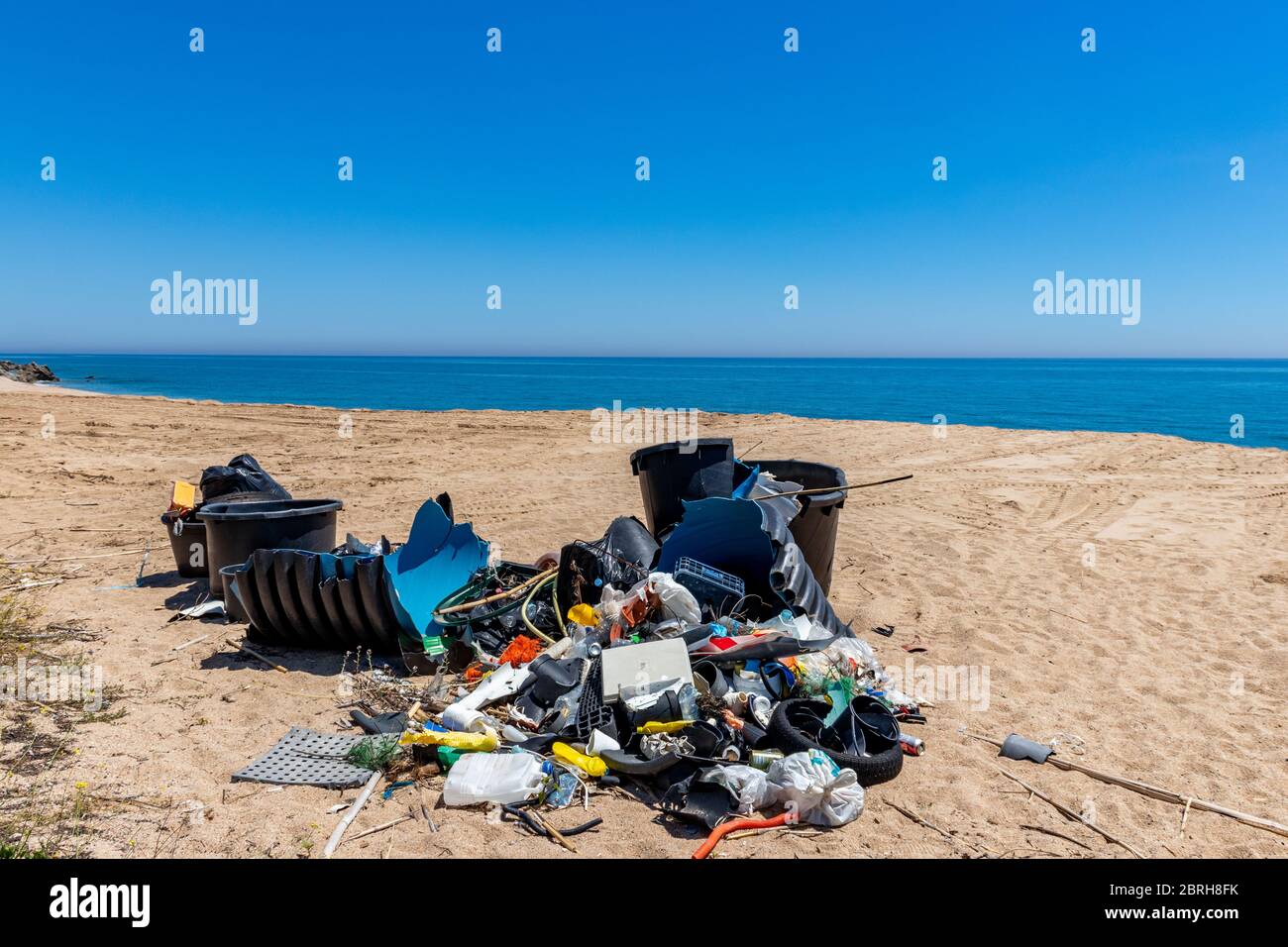 Plastic waste on a sandy beach in Canet de Mar north of Barcelona ...