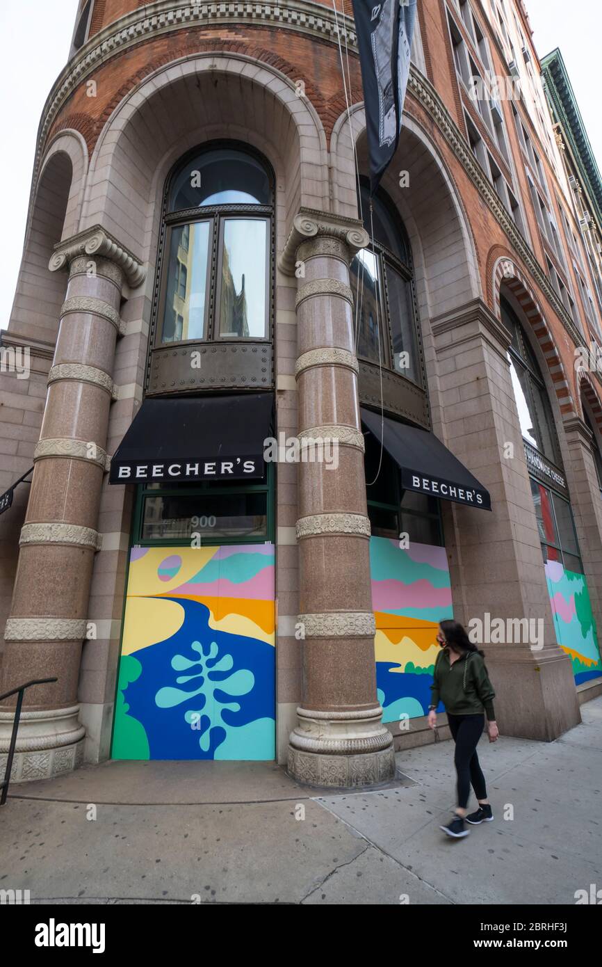 Colorful painted barricade board at storefront of BEECHER’S HANDMADE ...