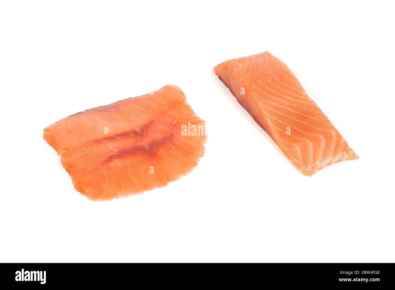 sliced red fish with lemon on white background Stock Photo - Alamy