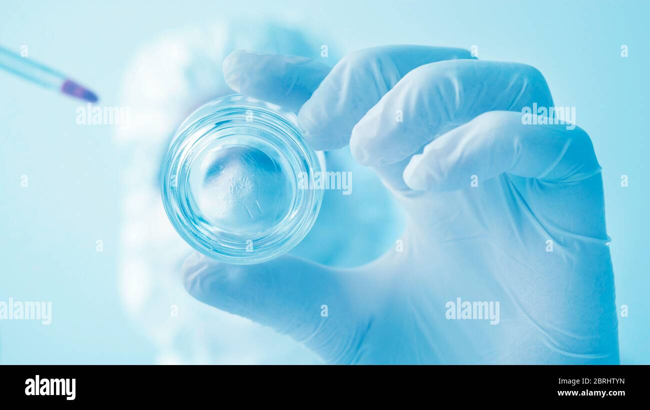Healthcare worker testing blood Stock Photo - Alamy