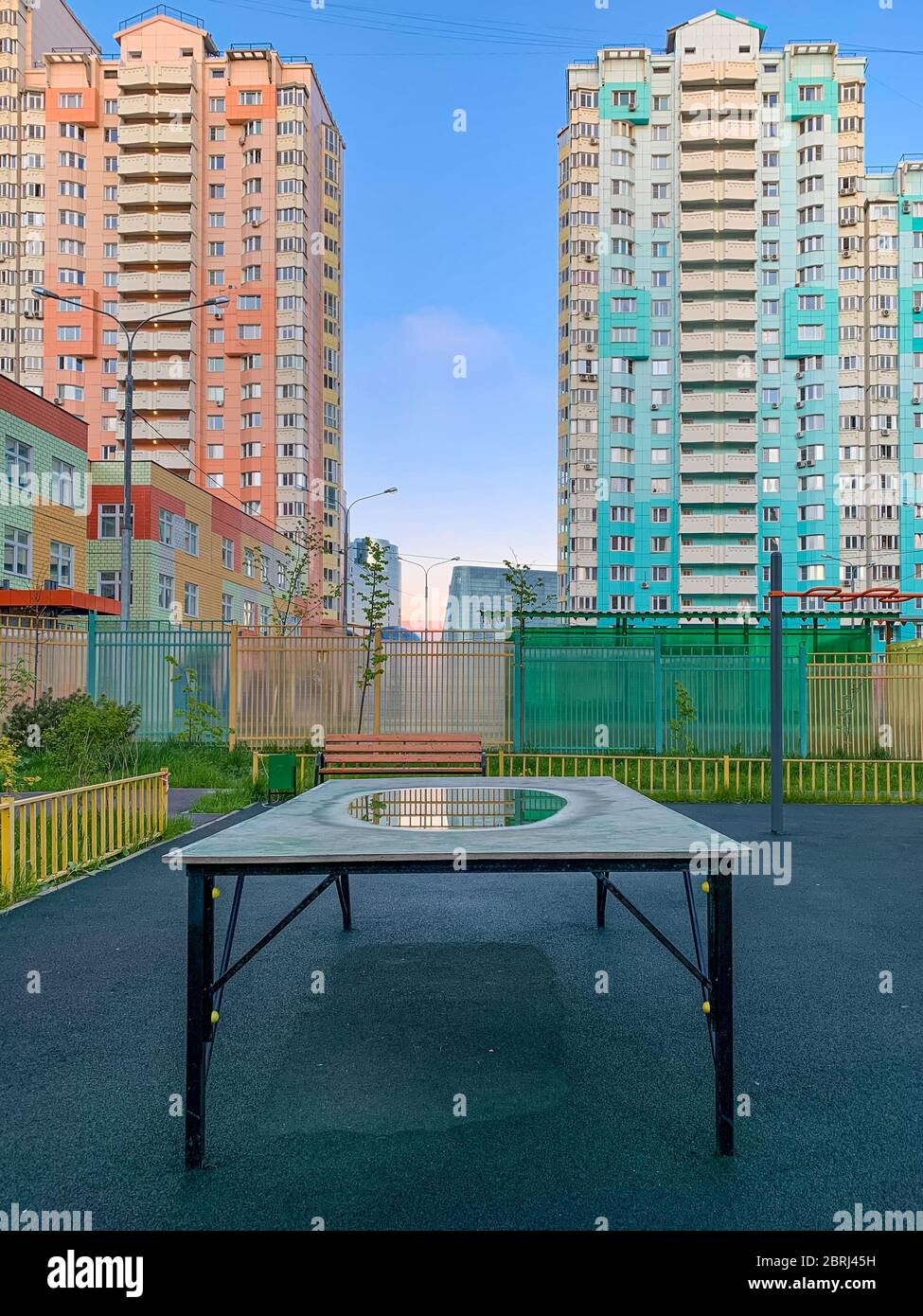 Tennis table on the playground in the courtyard of a residential ...