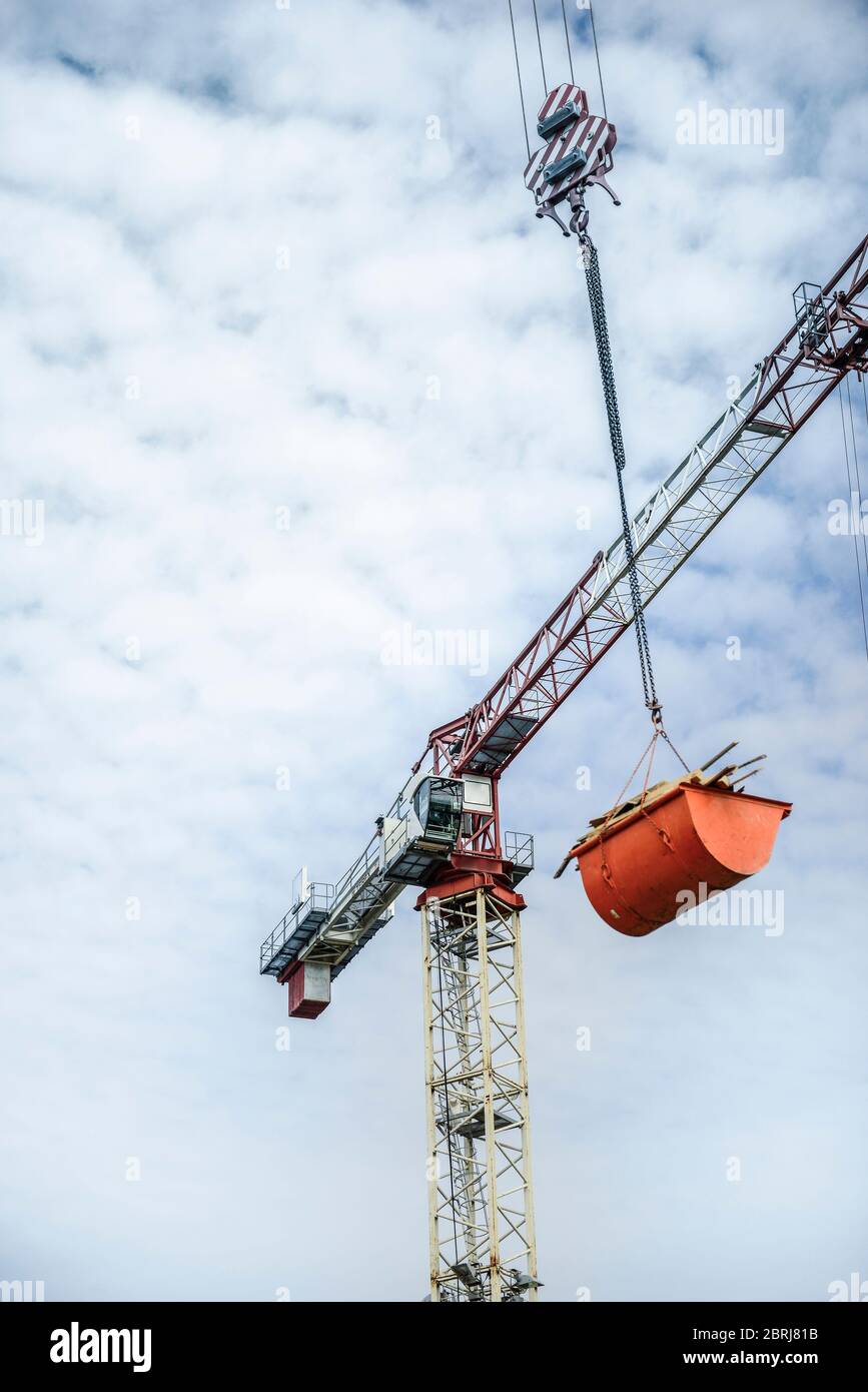 Crane transport debris and wood rests from a concrete structure ...