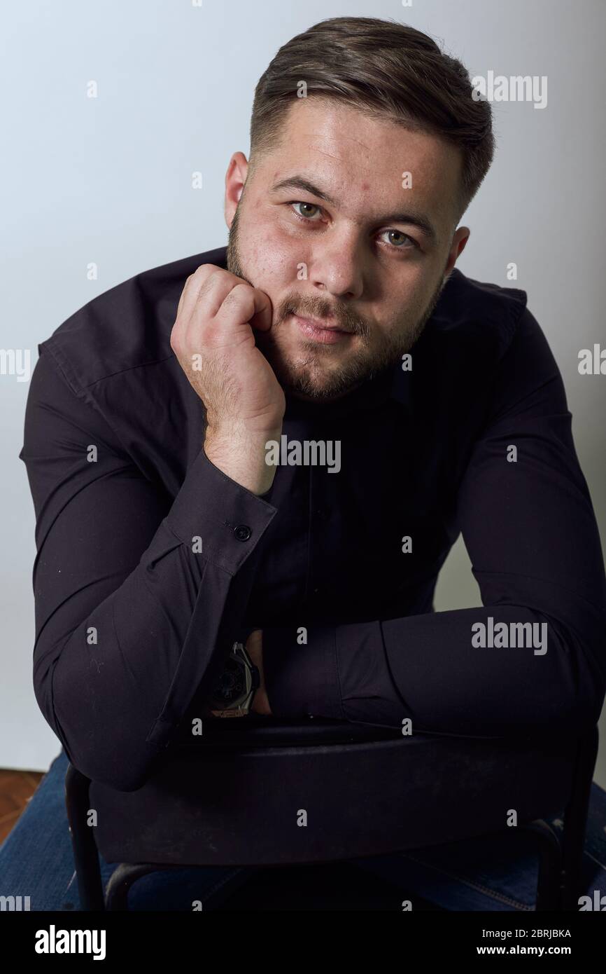 Portrait Cool Male, Sitting On A Chair. Stole Head On Hand Stock Photo ...