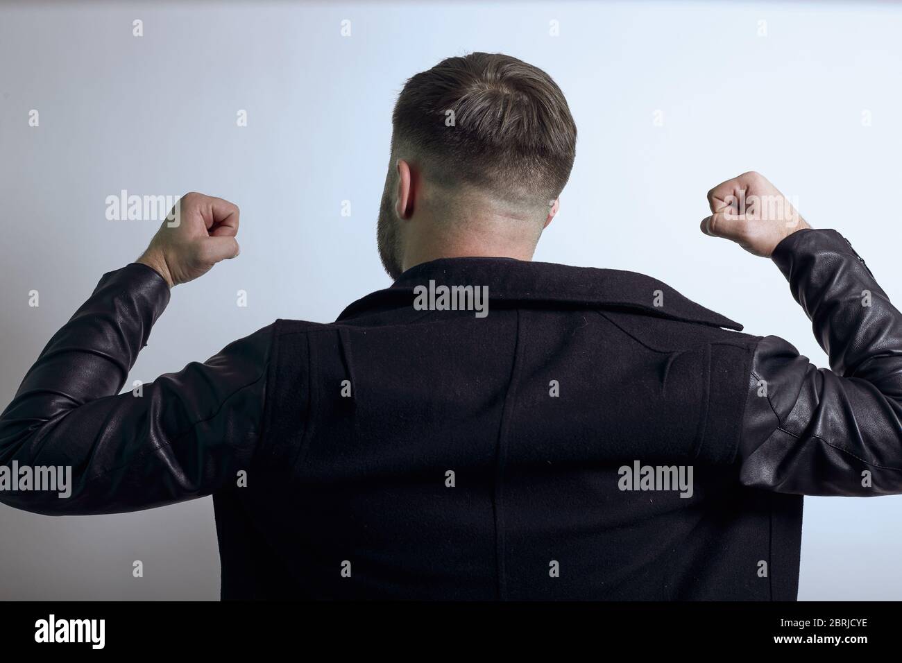 Solid Male Turned, Back, Shows Muscles On His Arms, Biceps. Powerful ...