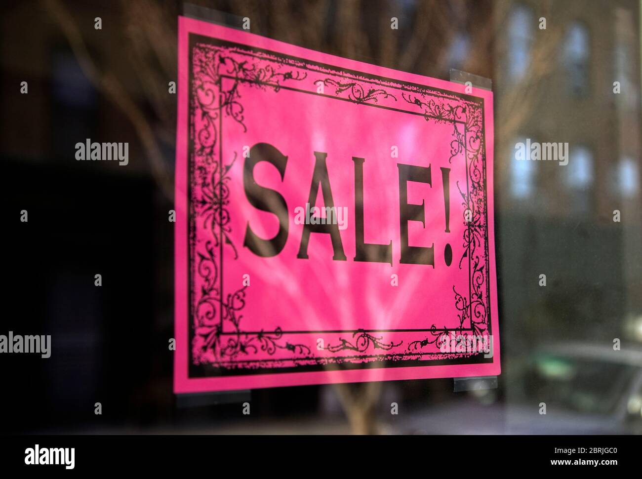 Sale Sign in Show Window Stock Photo - Alamy