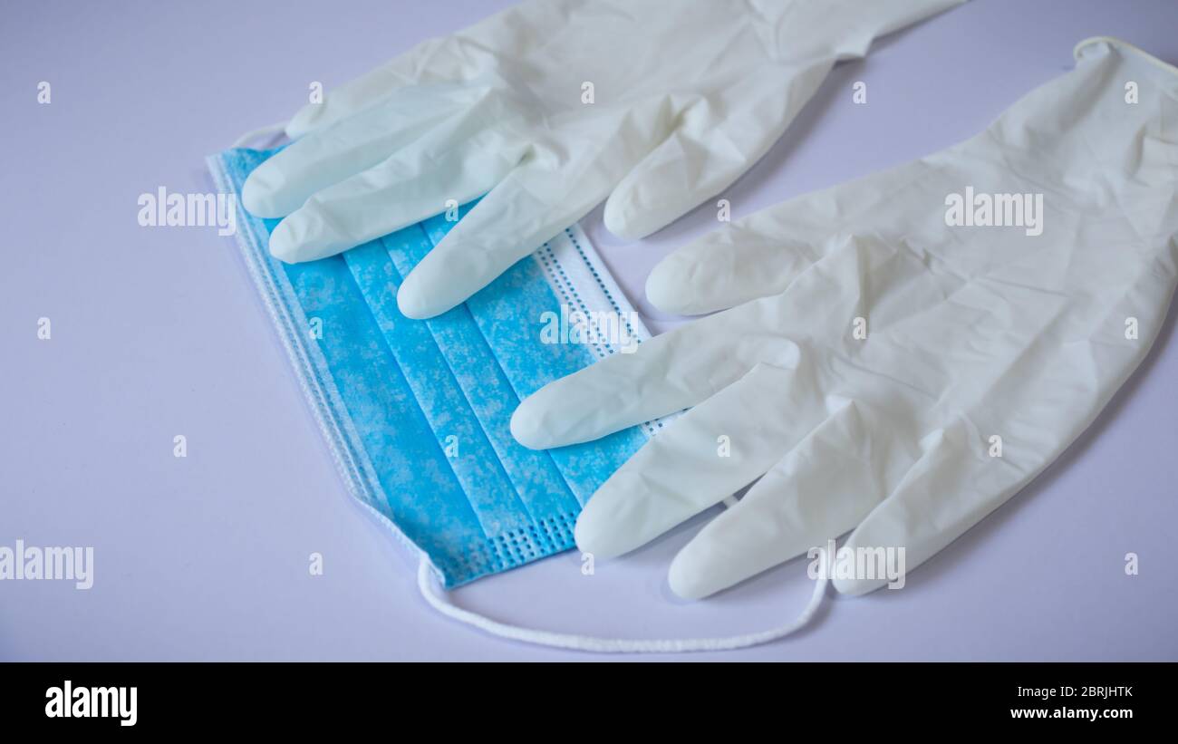Medical face mask and pair of latex medical gloves Stock Photo - Alamy