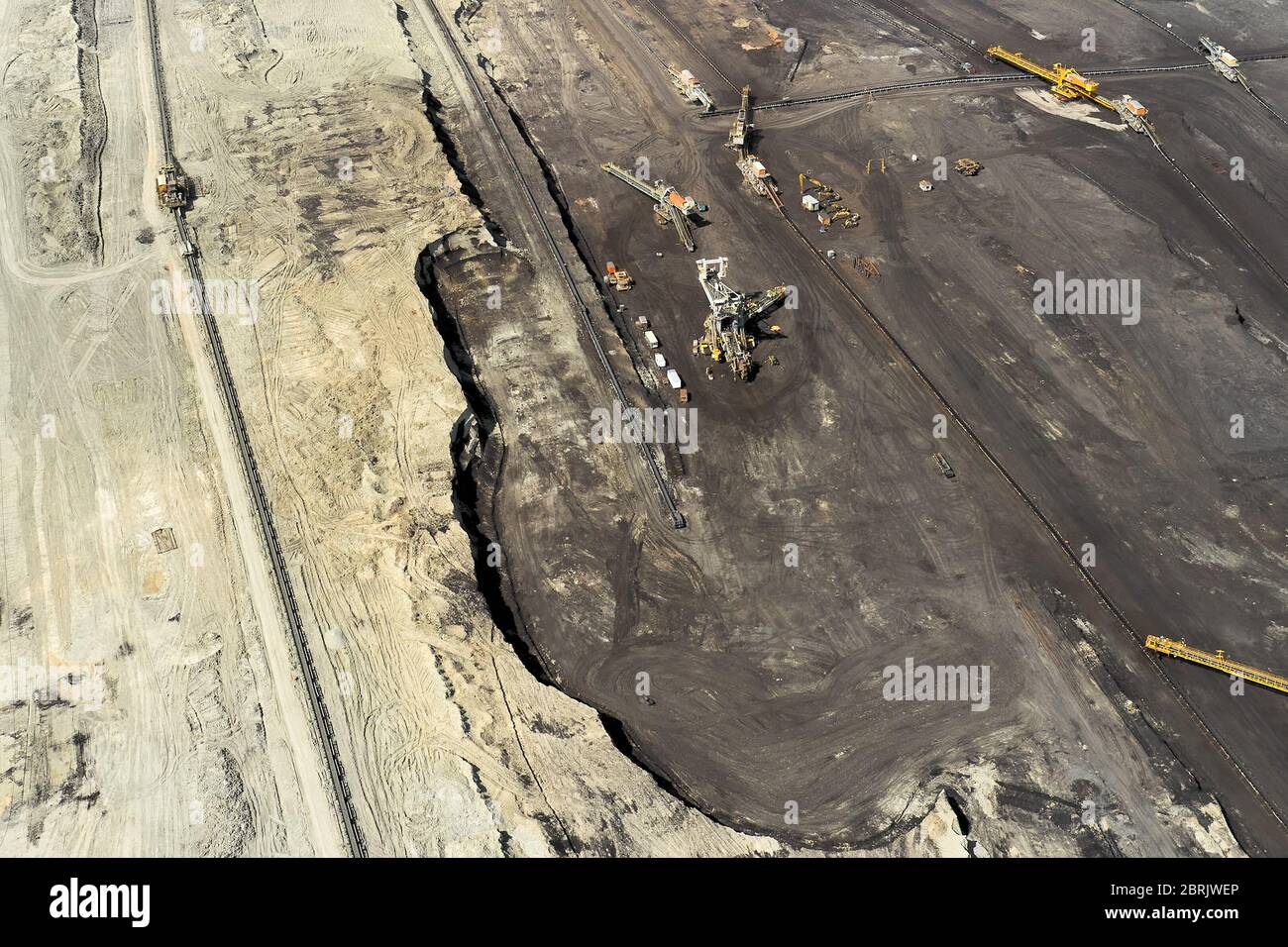 Top view of a mining quarry with huge equipment for coal or natural raw ...