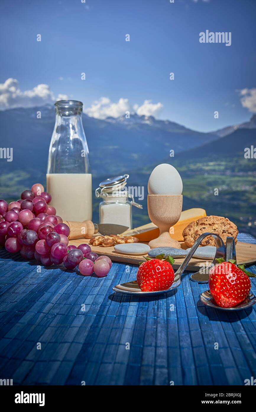 Energy Breakfast at sunny day in Switzerland Alps Stock Photo - Alamy