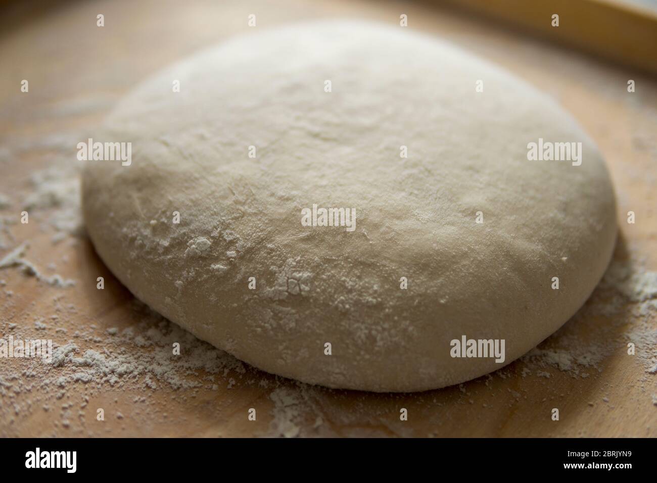 bread dough covered with flour on wooden pastry board Stock Photo - Alamy