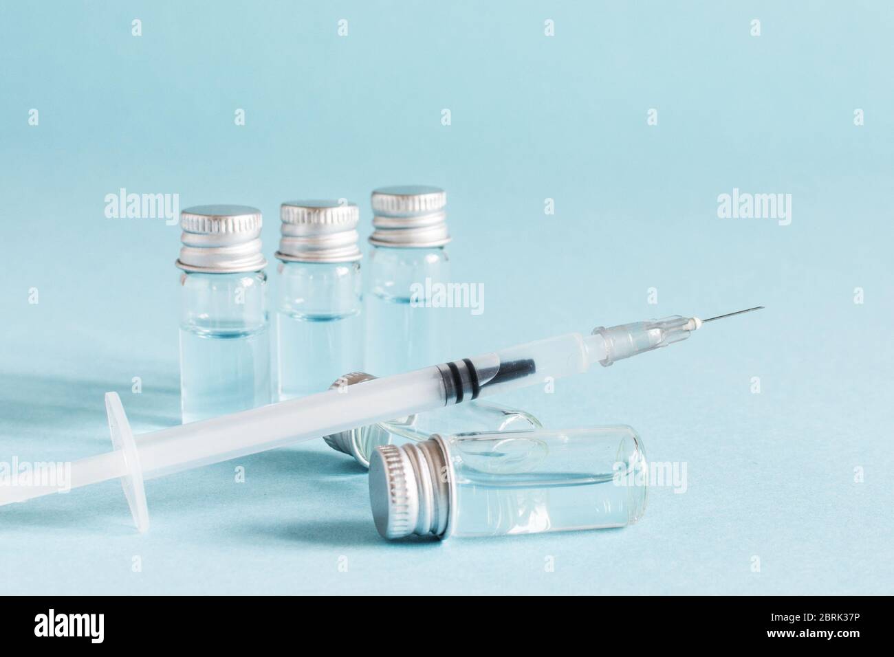 Medical glass vials and syringe for vaccination. Ampules for injection ...