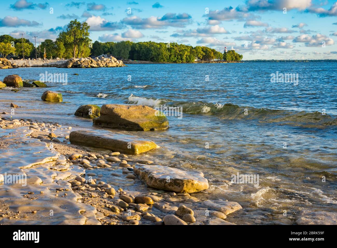 Lake Erie shoreline with distant lighthouse Stock Photo - Alamy