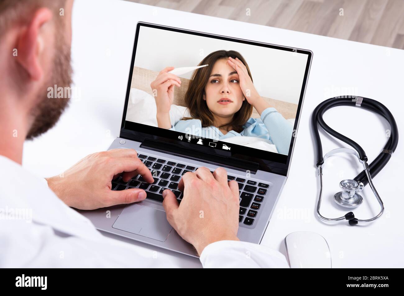 Sick patient using laptop in hi-res stock photography and images - Alamy