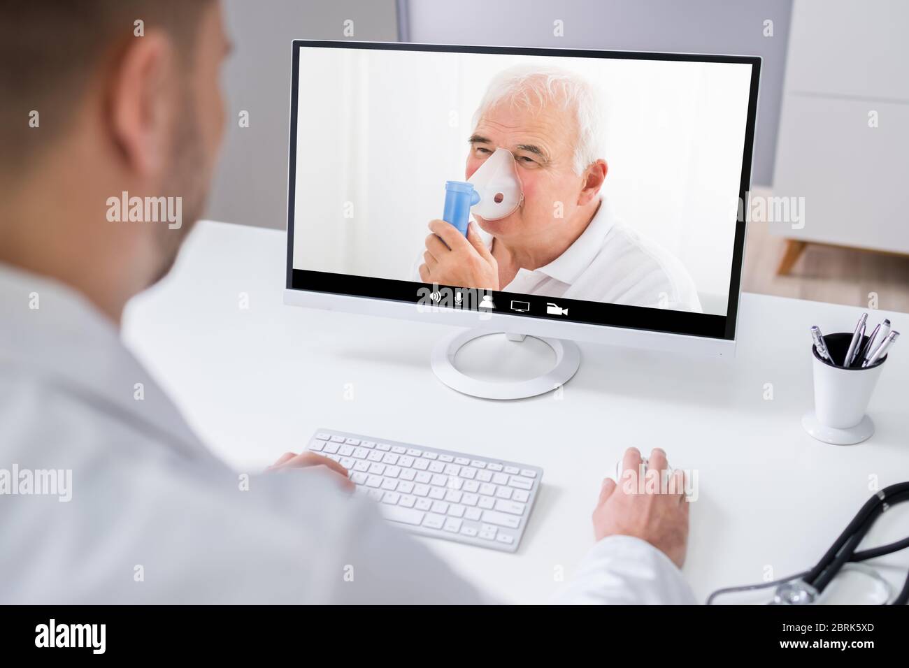Doctor In Video Conference Call With Senior Patient Using Oxygen ...