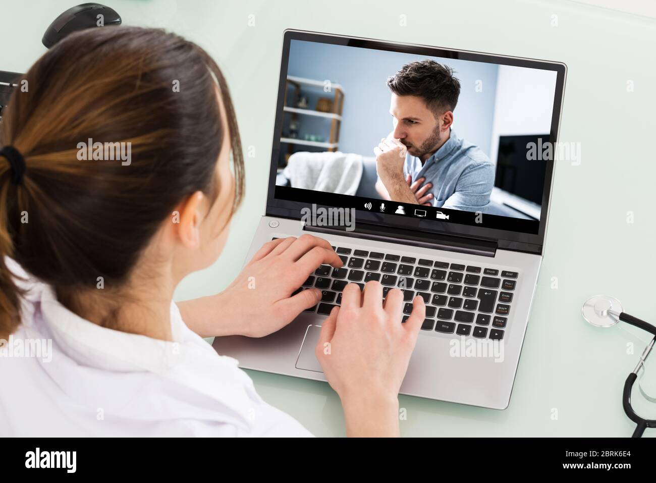 Sick patient using laptop in hi-res stock photography and images - Alamy