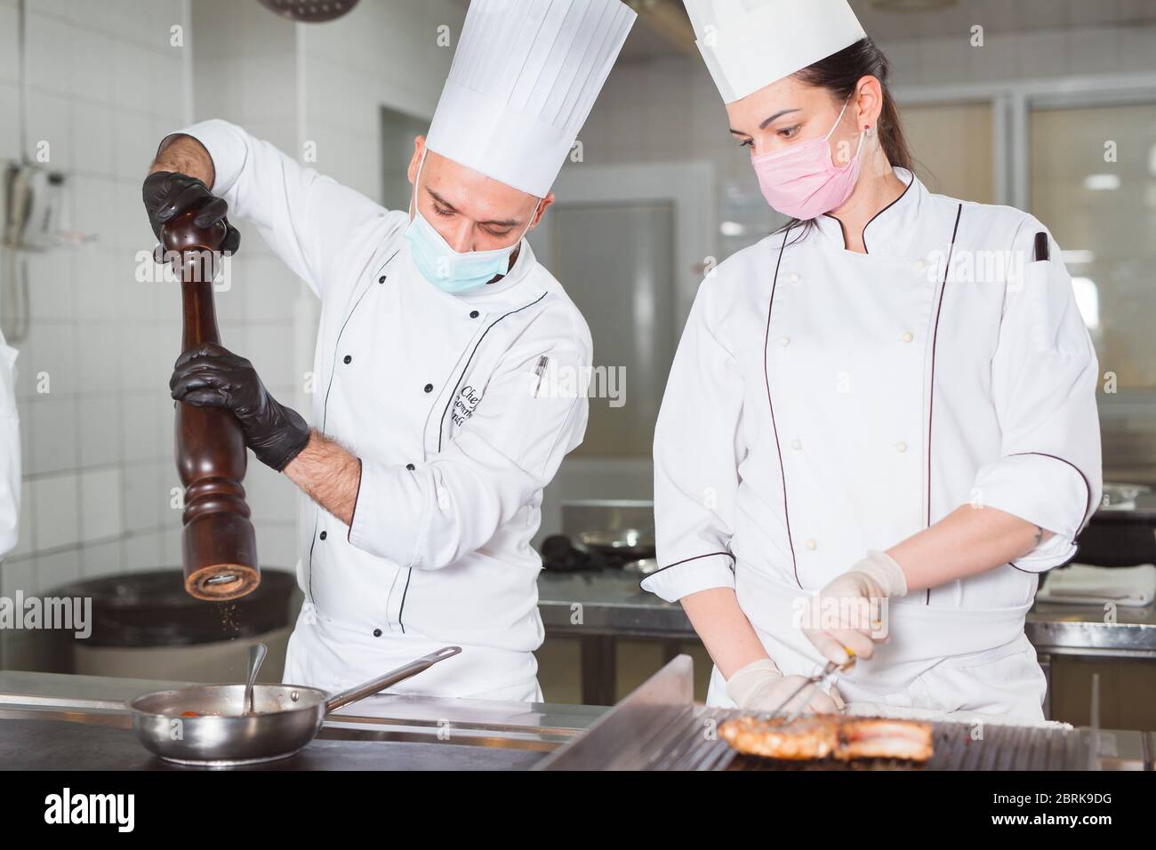 team of cooks cooks in a restaurant Stock Photo - Alamy