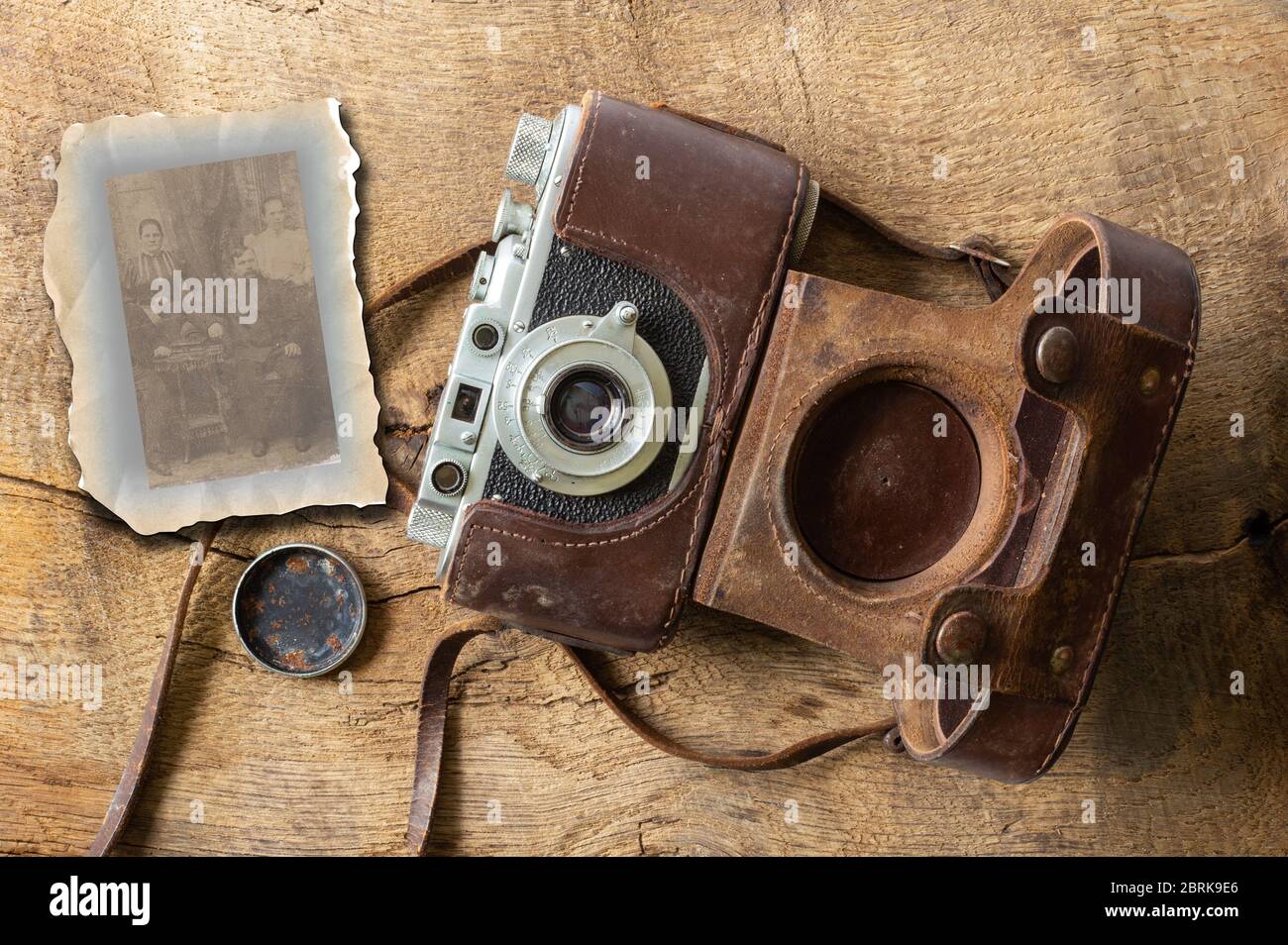 Collage of ancient old vintage film camera with old lether cover on ...