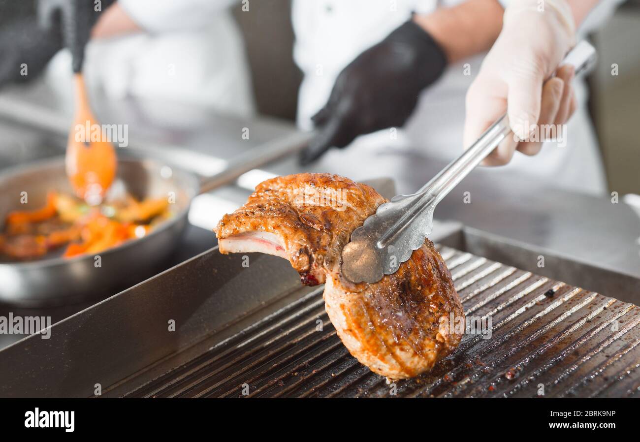 team of cooks cooks in a restaurant Stock Photo - Alamy